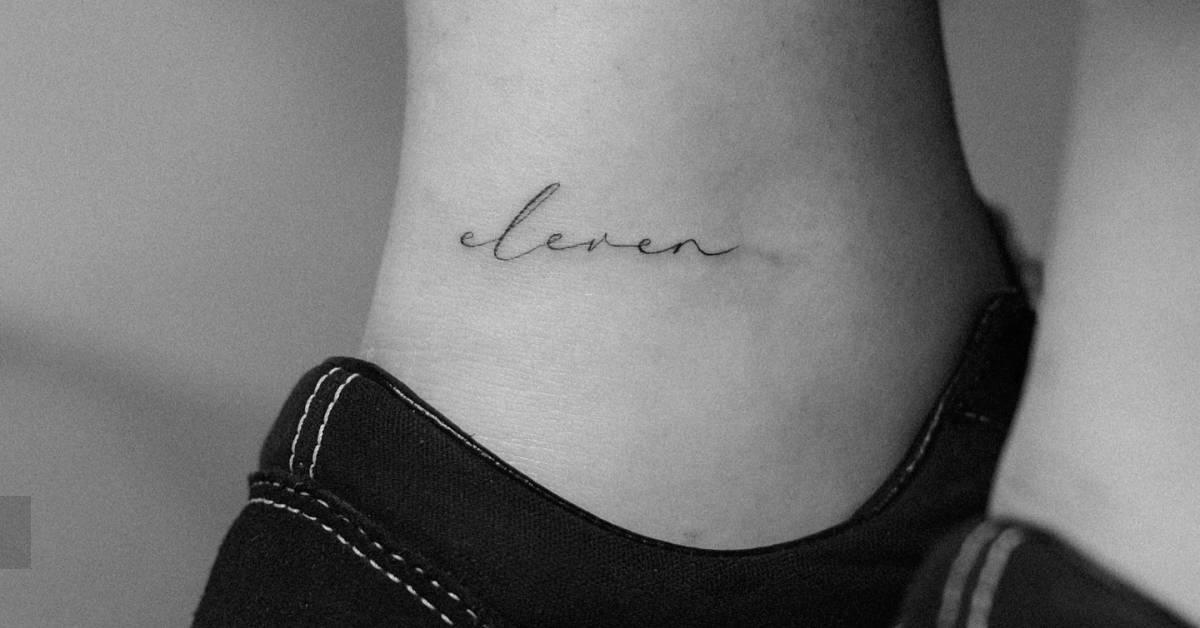 Tattoo of the word "eleven" located on the ankle.