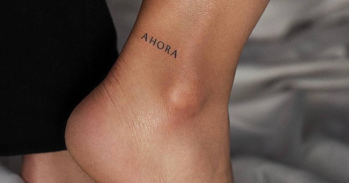 Tattoo of the word "ahora" located on the ankle.