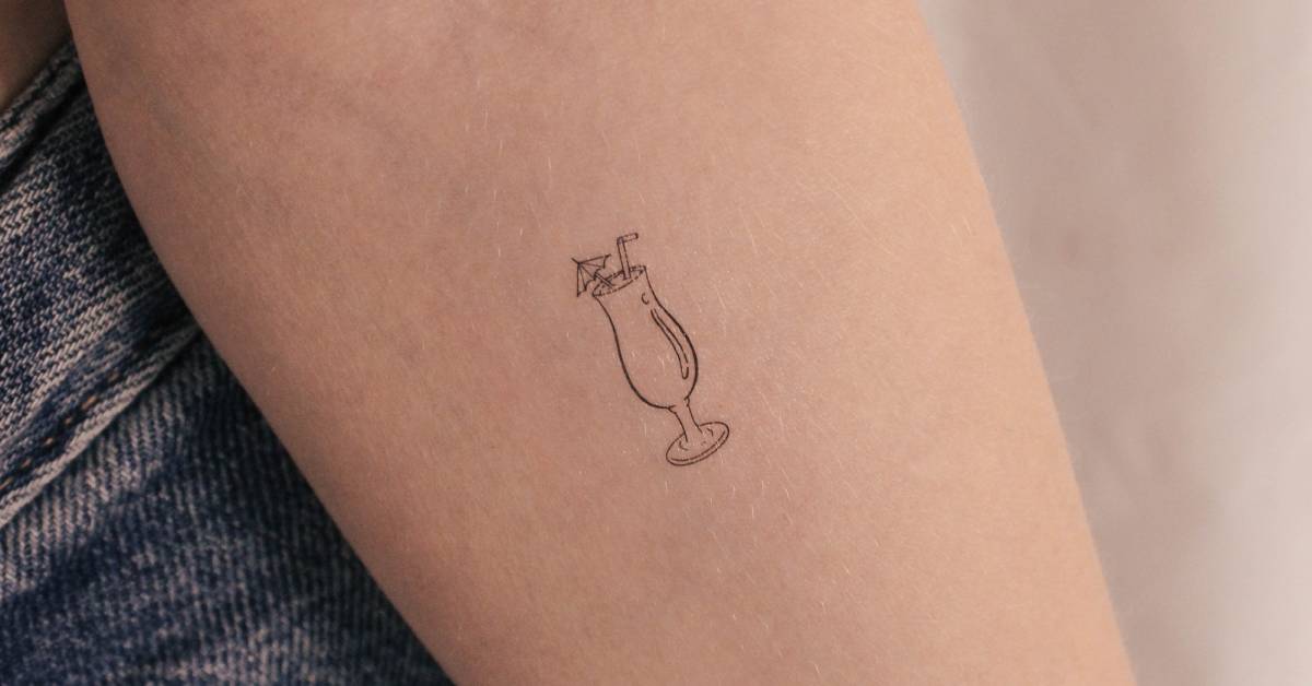 Fine line style Piña Colada temporary tattoo located