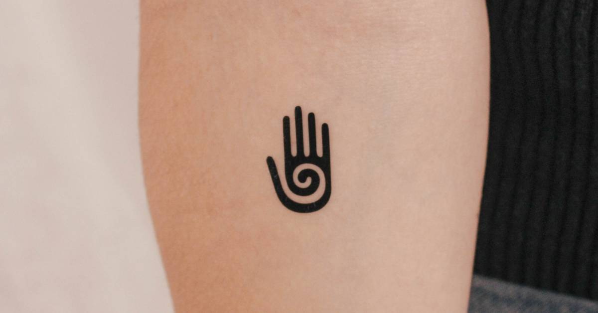 Minimalistic style Hopi Hand temporary tattoo located