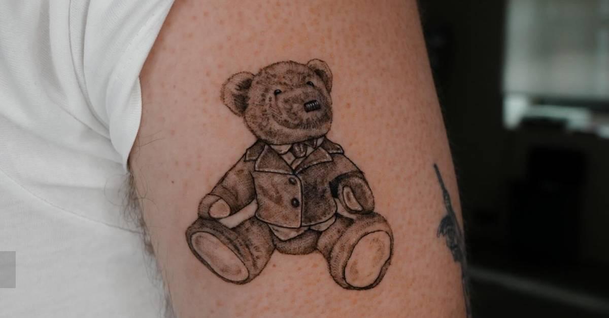 Teddy bear tattoo in illustrative style located on the