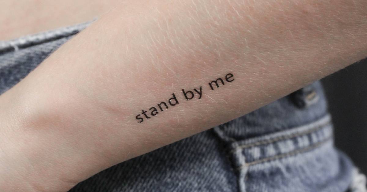 "Stand by me" temporary lettering tattoo located on the