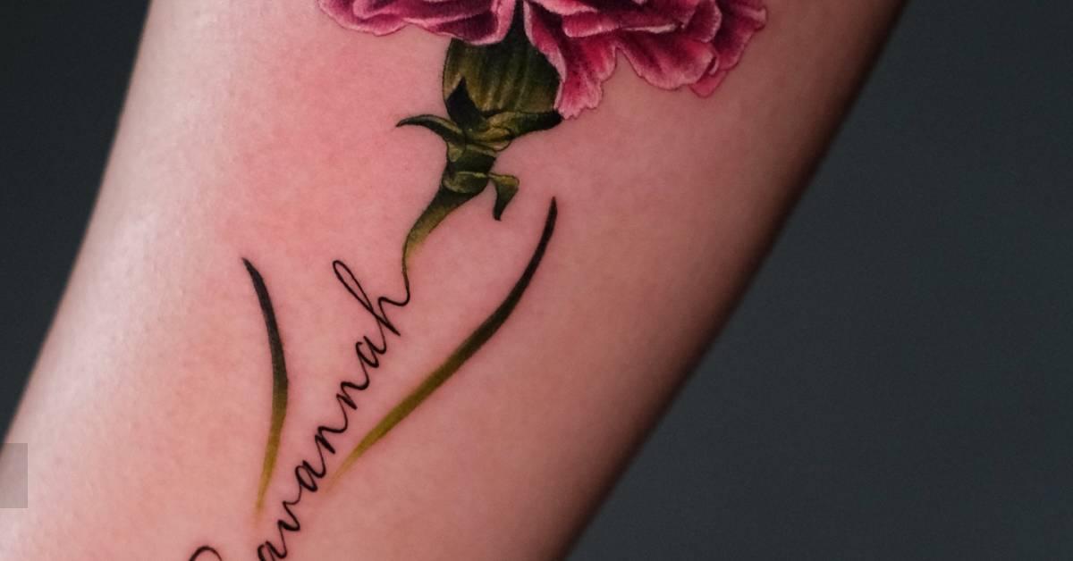 Carnation and name "Savannah" tattooed on the inner