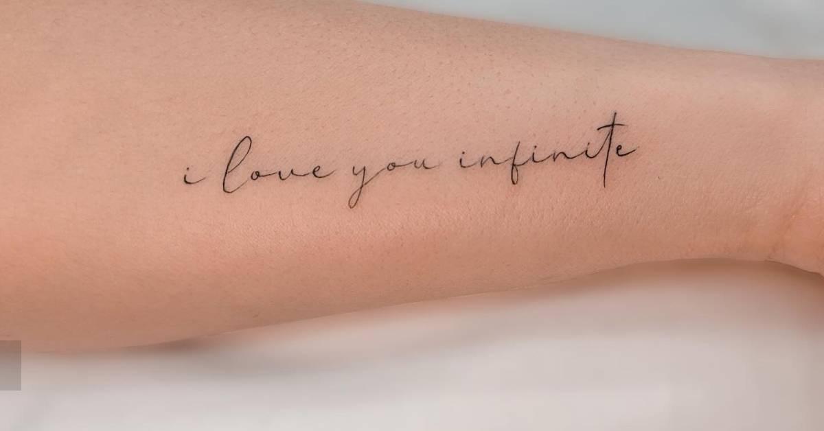 "I love you infinite" lettering tattoo located on the