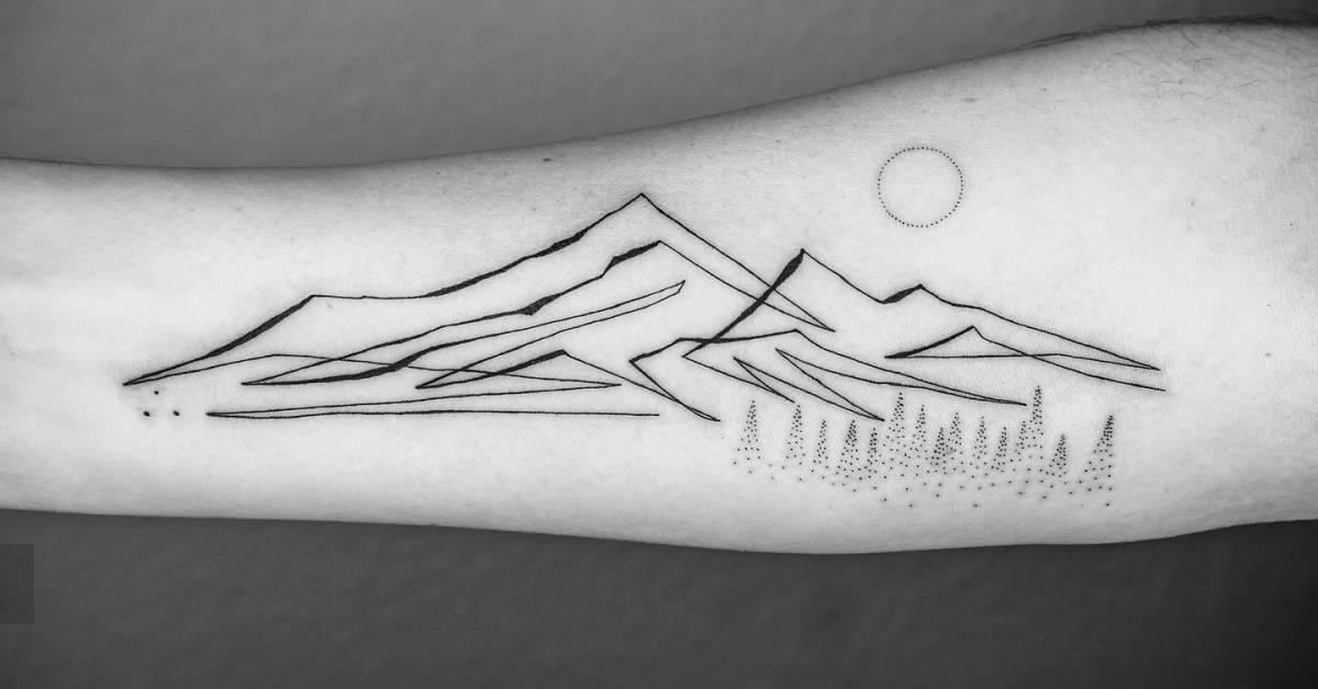 Abstract mountain landscape tattoo located on the inner