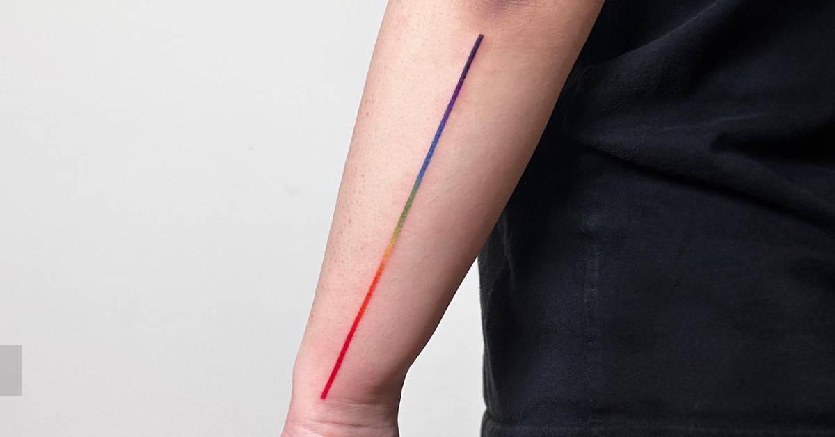 Visible spectrum line tattoo located on the forearm.