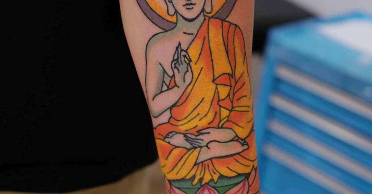 Buddha tattoo in traditional style placed on the inner
