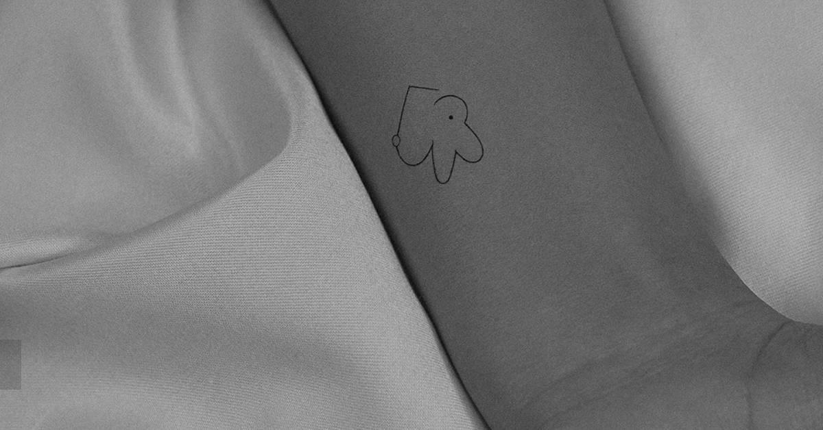 Minimalistic style rabbit tattoo located on the wrist.