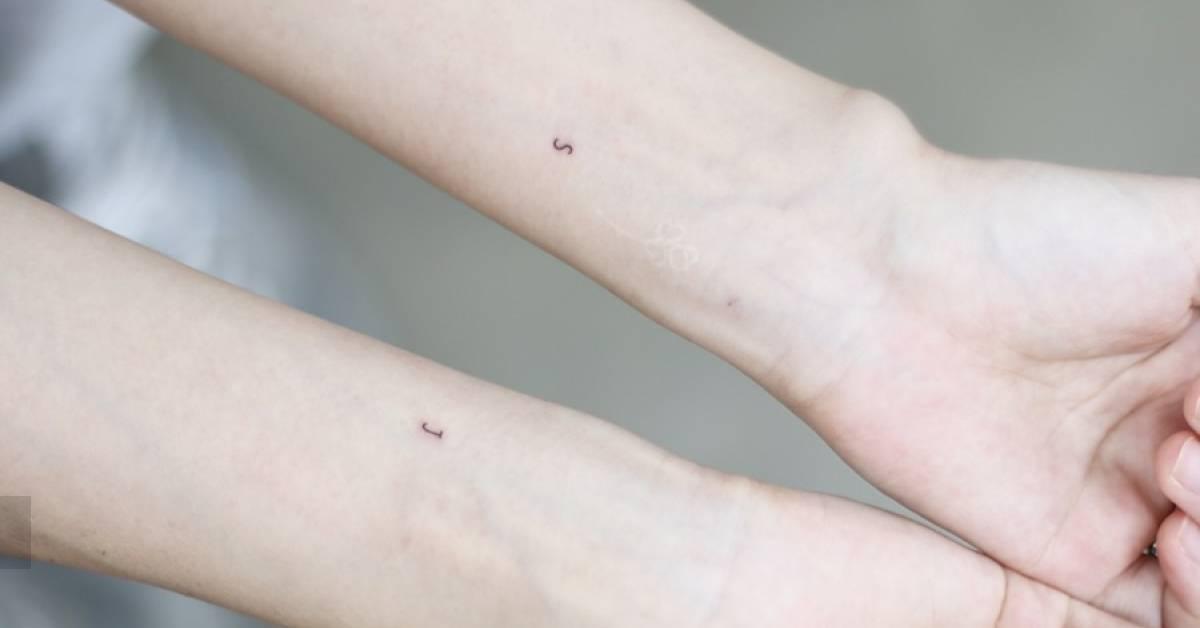 Individual matching initials "S" and "J" tattoo located