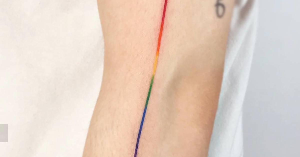 Visible spectrum line tattooed on the elbow.