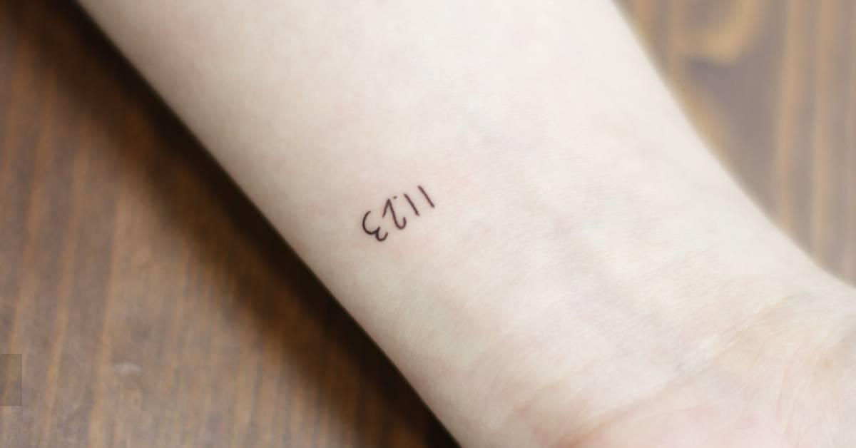 Minimalistic style date tattoo located on the wrist.