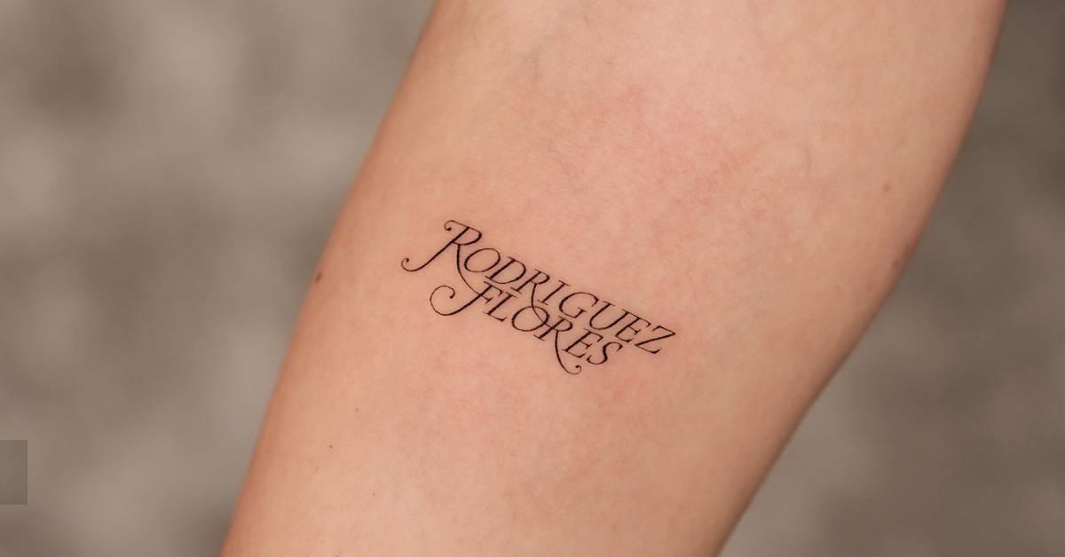 Name tattoo located on the inner forearm.