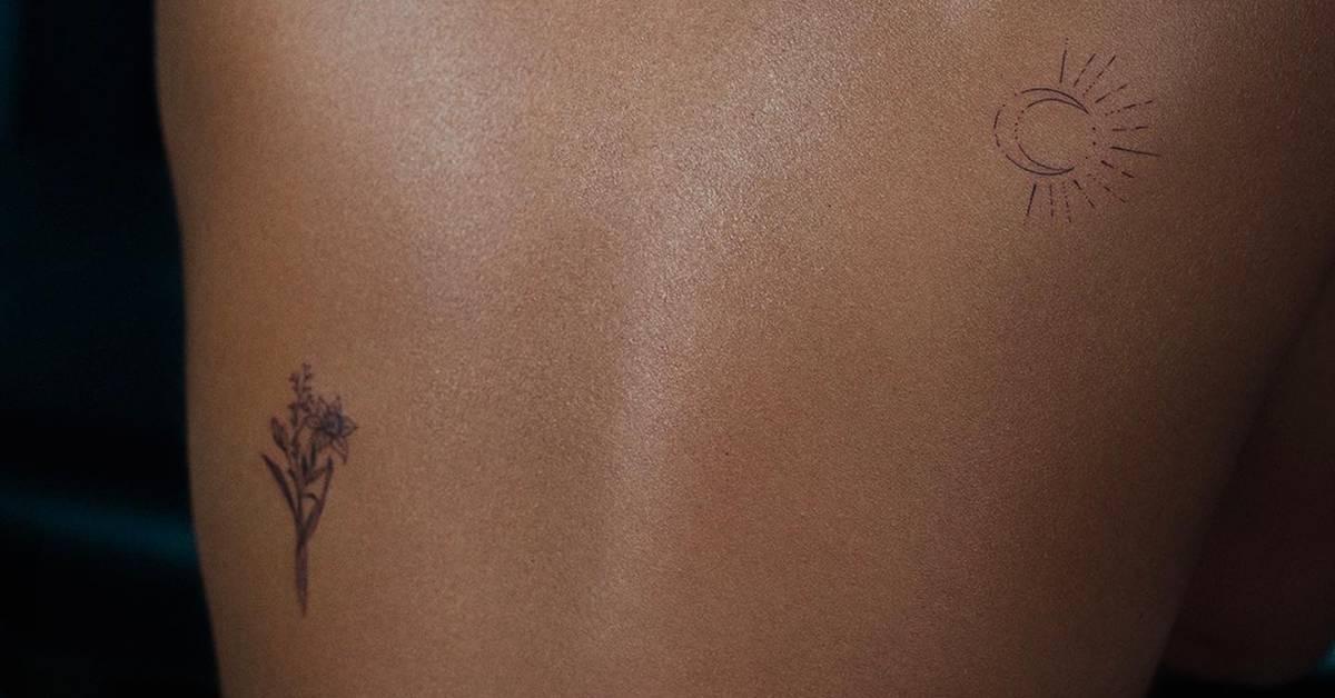 Fine line style back composition tattoos.