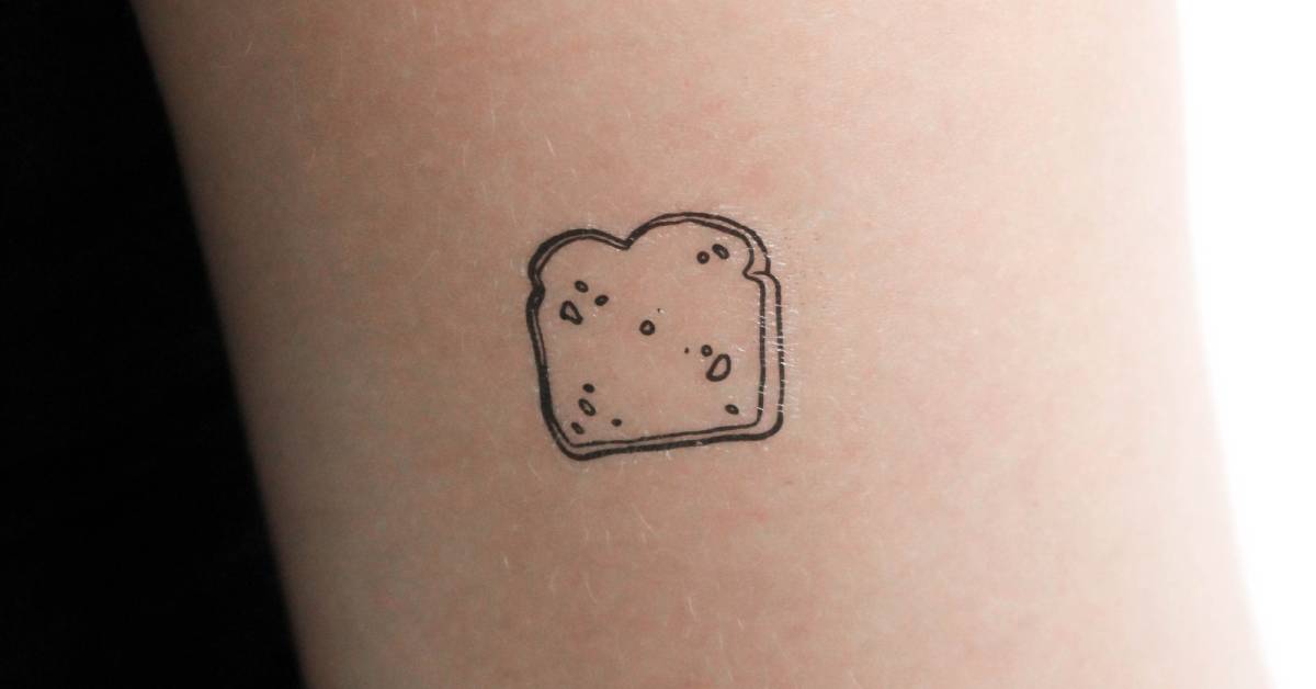 Minimalistic style toast temporary tattoo located on