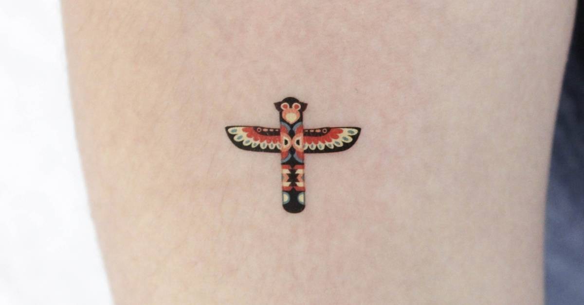 Illustrative style totem temporary tattoo located on