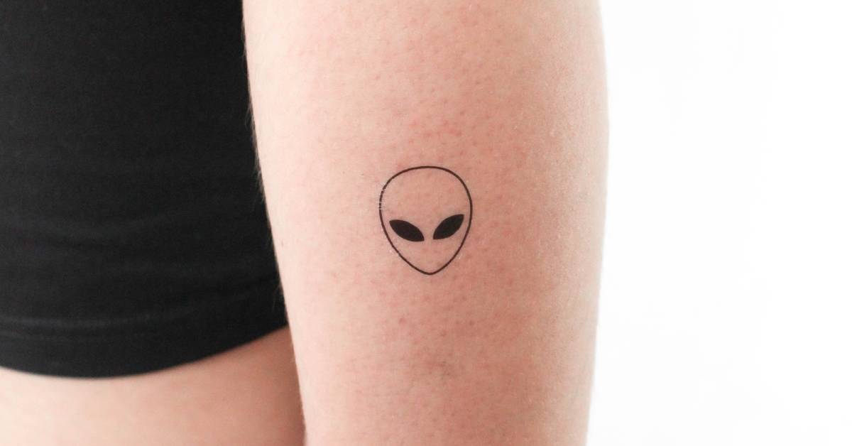 Alien head temporary tattoo on the back of the right