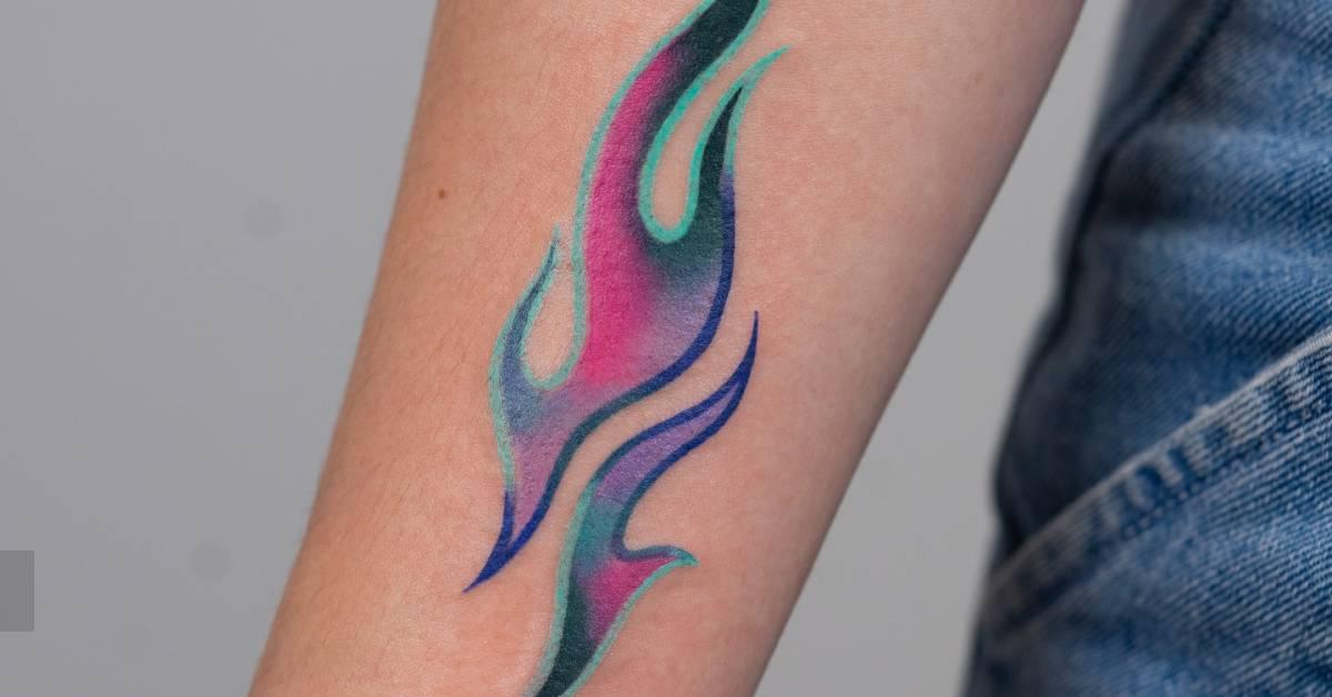 Fire tattoo located on the inner forearm, illustrative