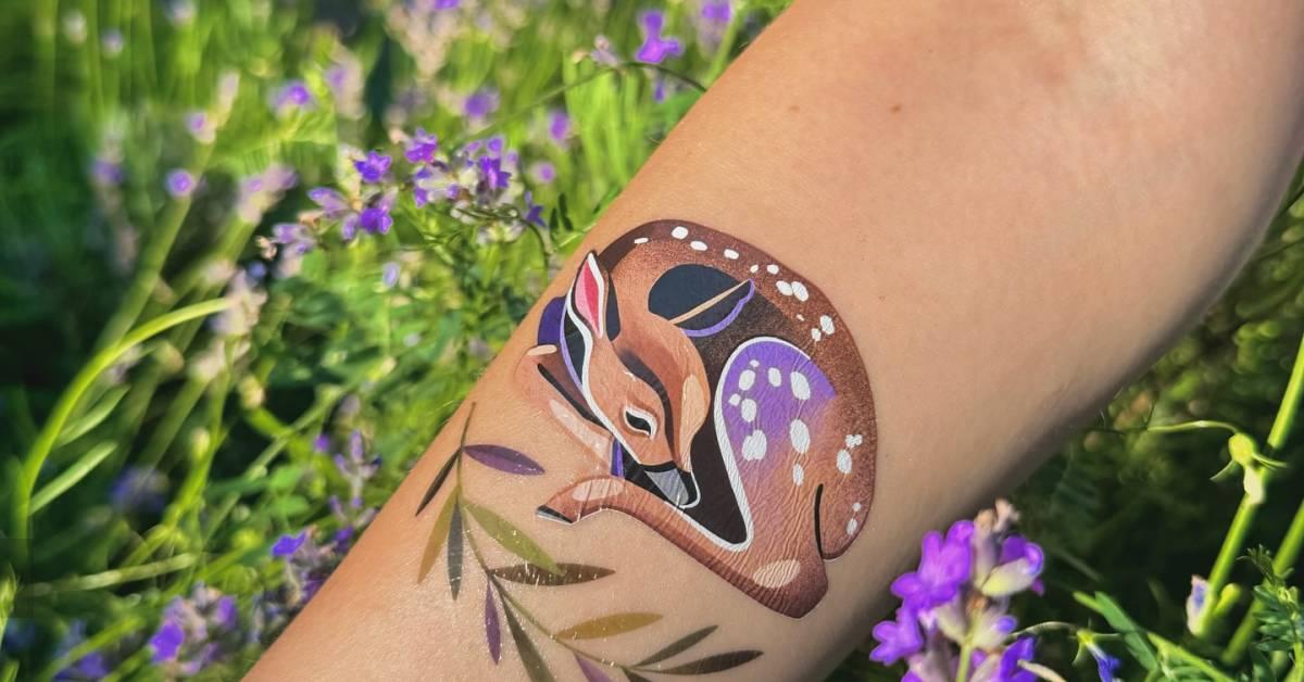 Illustrative style fawn tattoo located on the inner