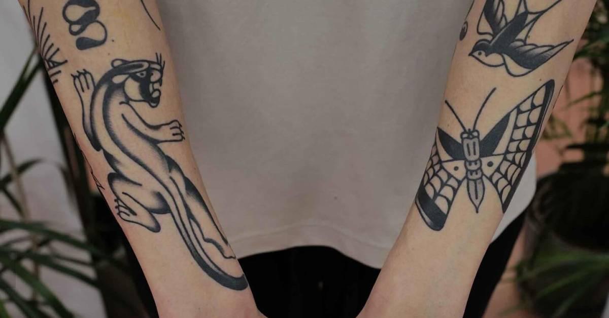 Healed forearm composition tattoos in traditional