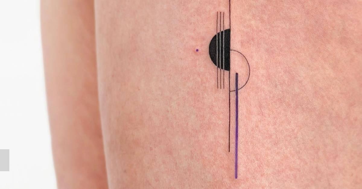 Abstract geometric tattoo located on the thigh.