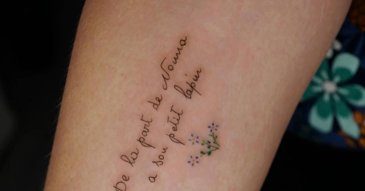 Memorial handwritten lettering tattoo located on the
