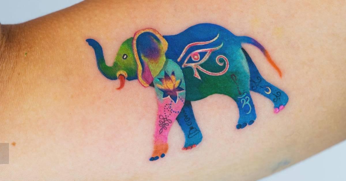 Colorful elephant tattoo located on the inner arm.