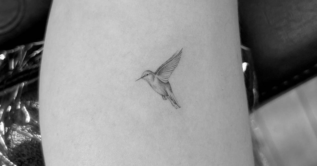 Hummingbird tattoo in micro-realistic style located on