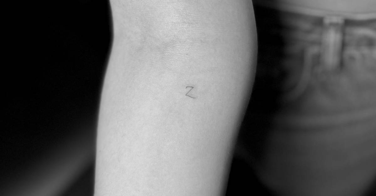 Tiny minimalistic letter "Z" tattoo located on the