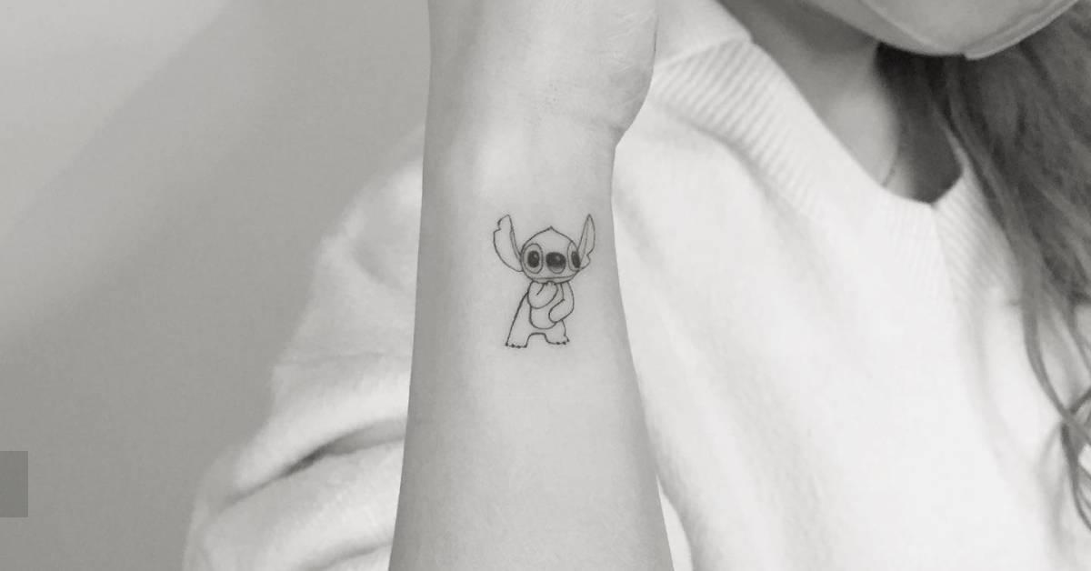 Minimalistic style Stitch tattoo located on the wrist.