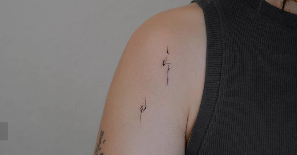 Abstract tattoo located on the shoulder.