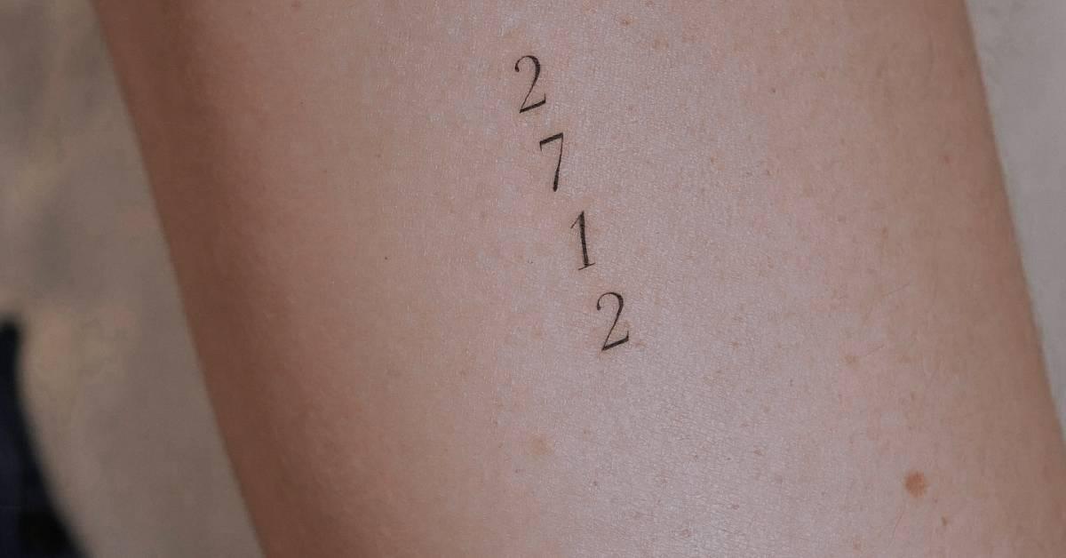 Number "2712" tattoo located on the forearm.
