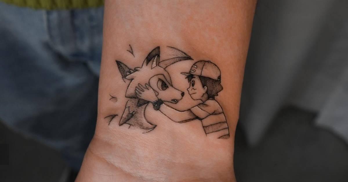 Ash Ketchum tattoo located on the wrist, cartoon style.