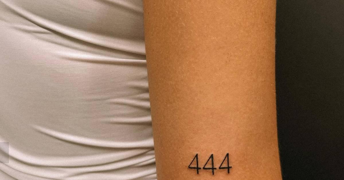 Angel number "444" lettering tattoo placed on the
