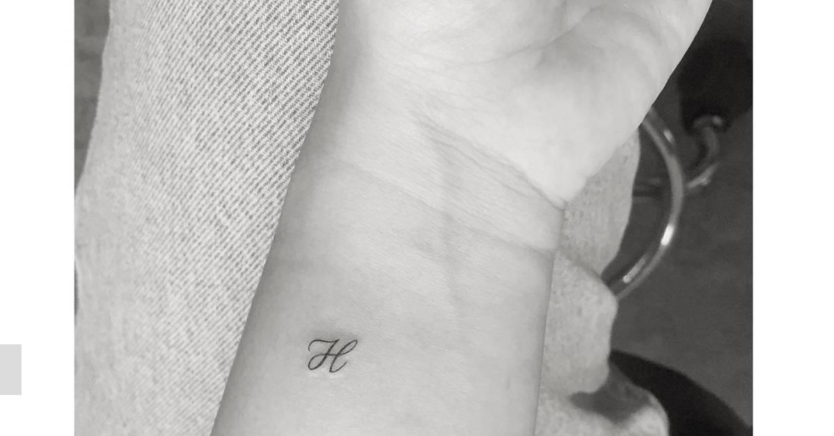 Minimalistic tiny letter "H" tattoo done on the wrist.