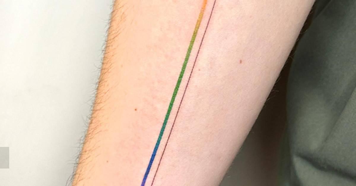 Spectrum lines tattooed on the inner forearm.
