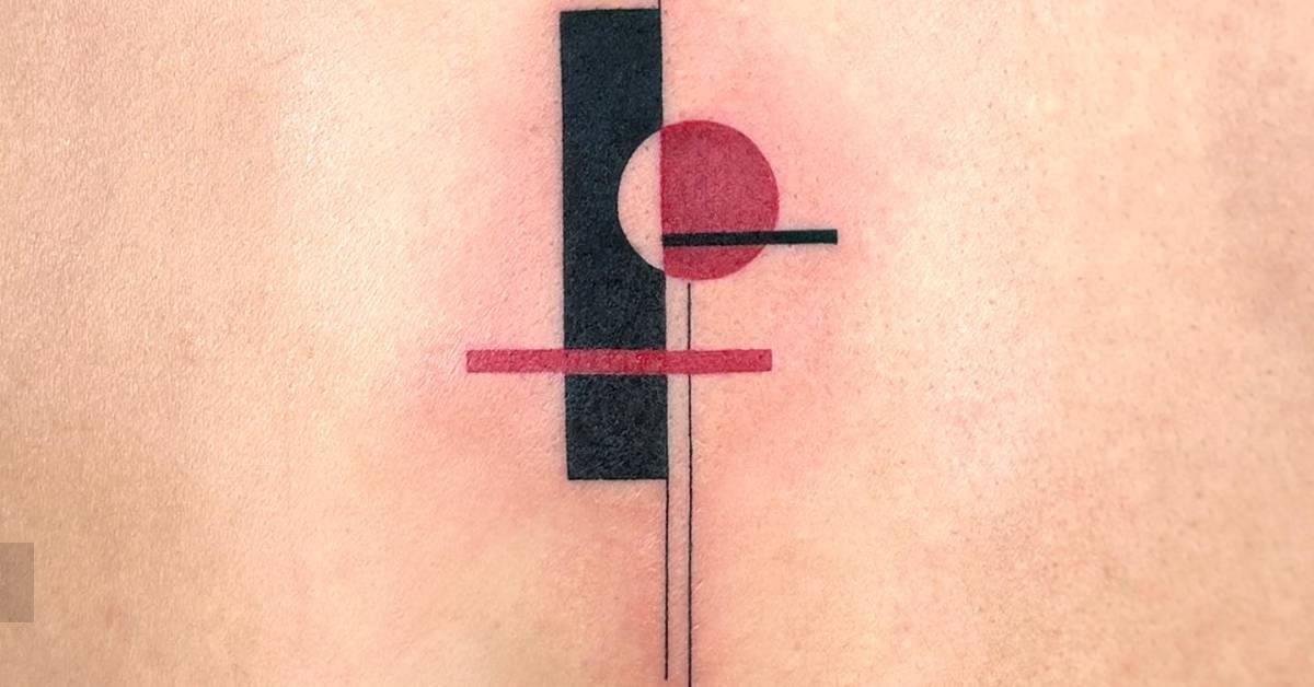 Abstract geometric tattoo located on the upper back.