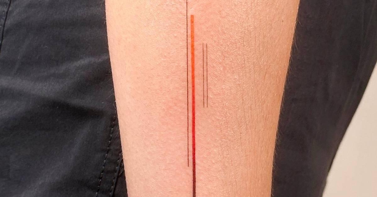 Spectrum lines tattoo located on the forearm.
