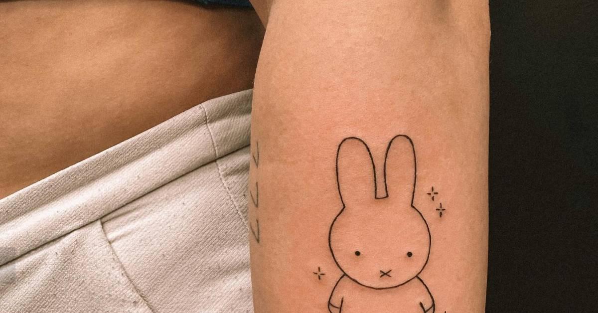 Cute minimalistic Miffy tattoo located on the forearm.