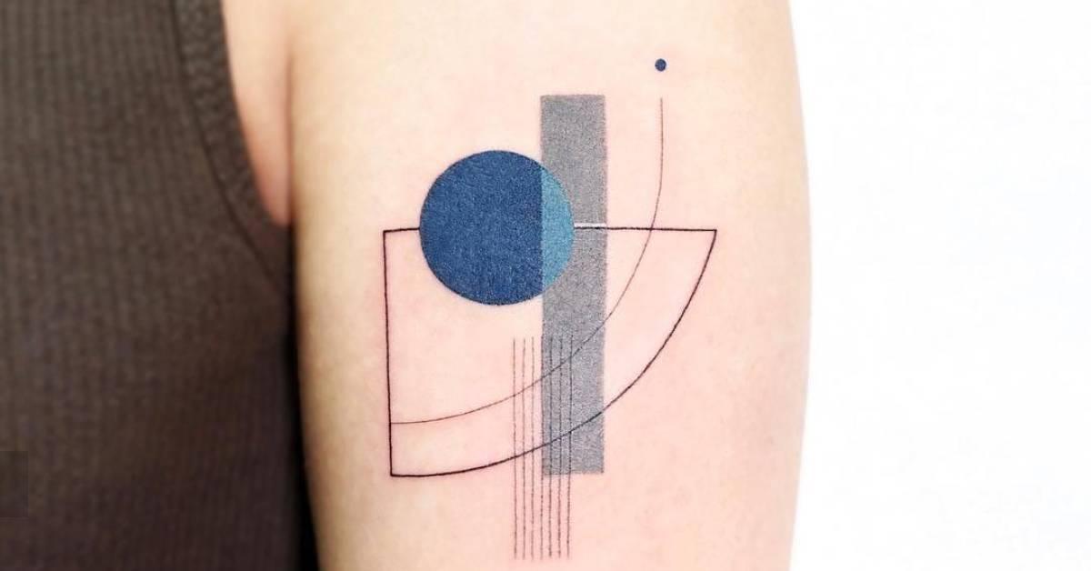 Abstract geometric tattoo done on the upper arm.