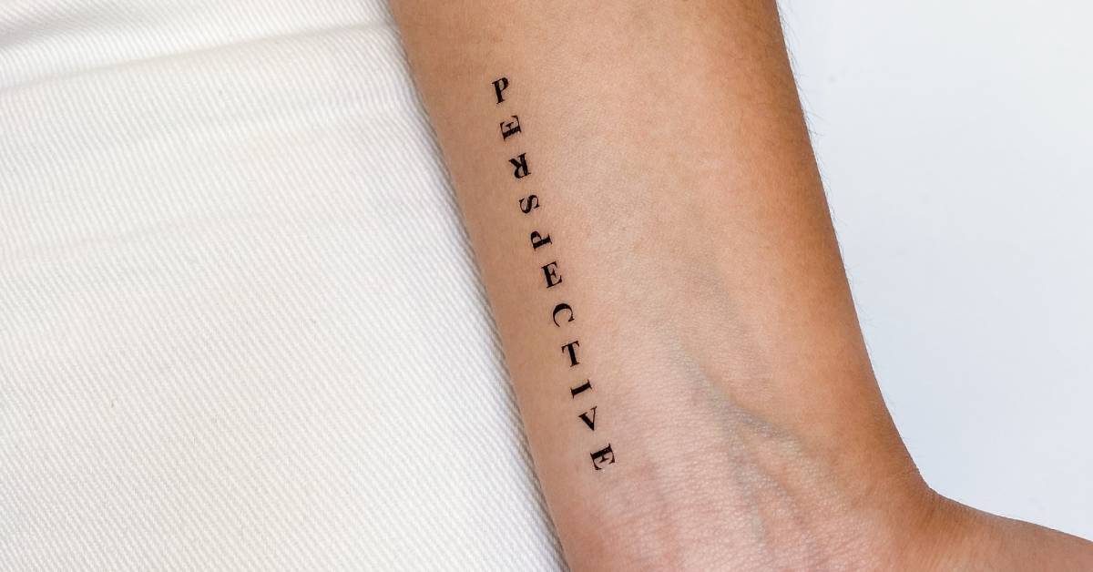 Word "perspective" temporary tattoo located on the