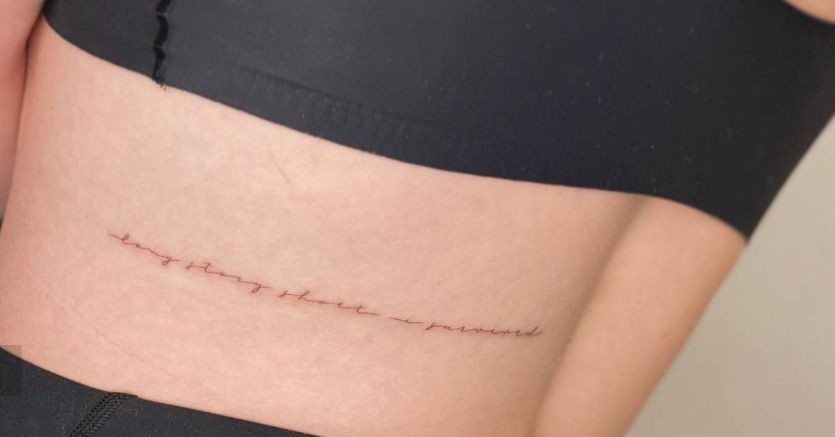 "Long story short, I survived" lettering tattoo located