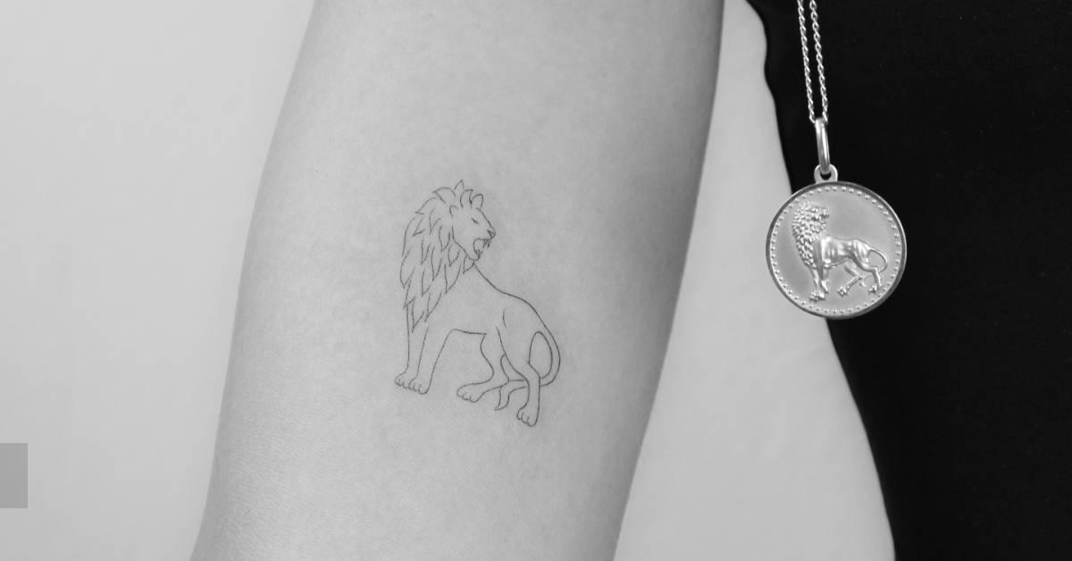 Lion tattoo in fine line style done on the inner arm.