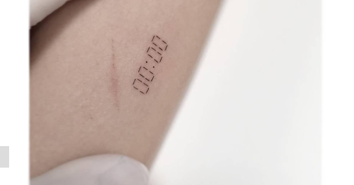 Hour tattoo located on the inner forearm, minimalistic