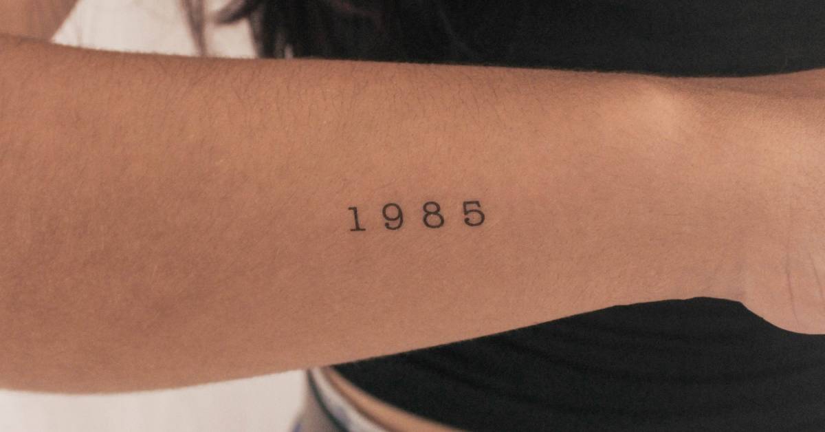 "1985" birth year temporary tattoo located on the