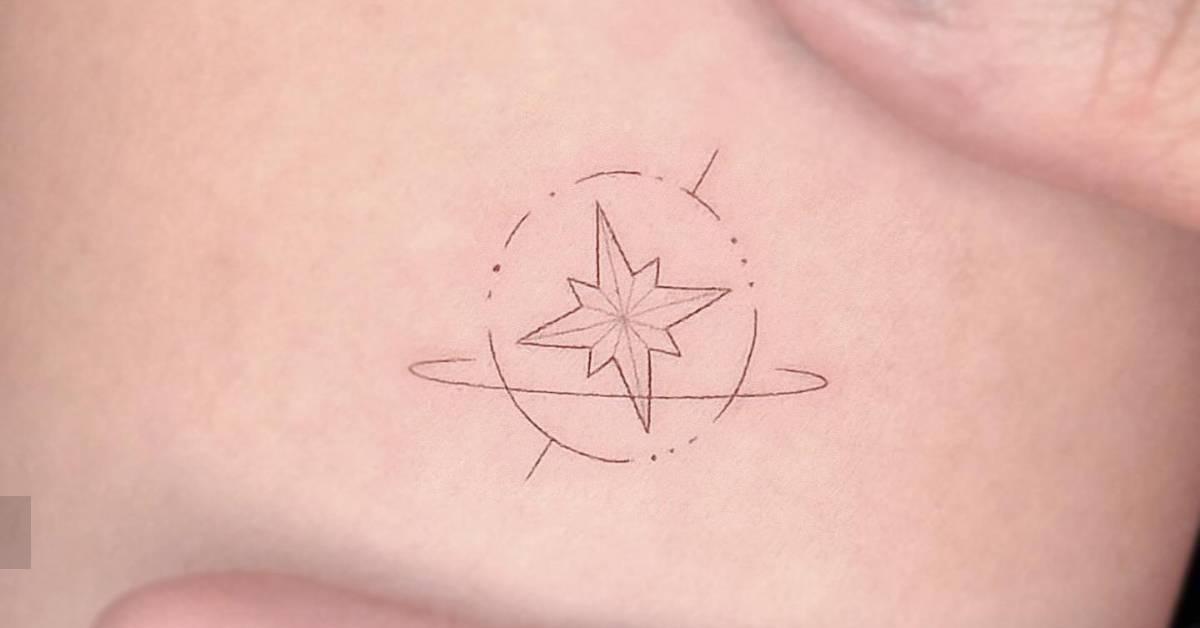 Fine line style star tattoo located on the inner