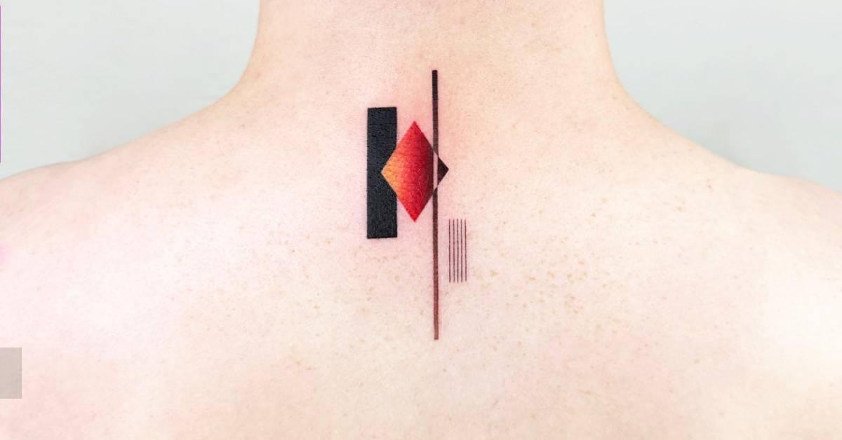 Abstract geometric tattoo placed on the upper back.