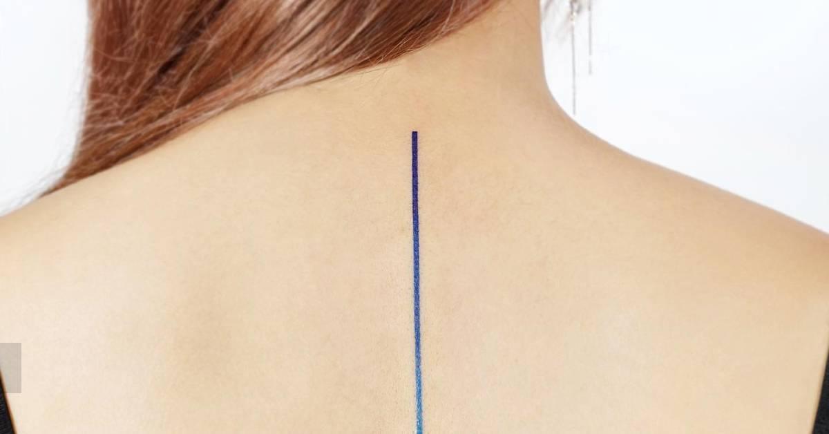 Thin spectrum line tattoo done on the upper back.