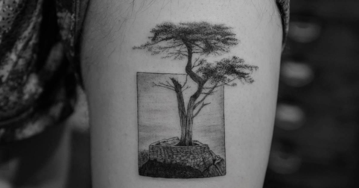Lone Cypress tattoo located on the thigh,