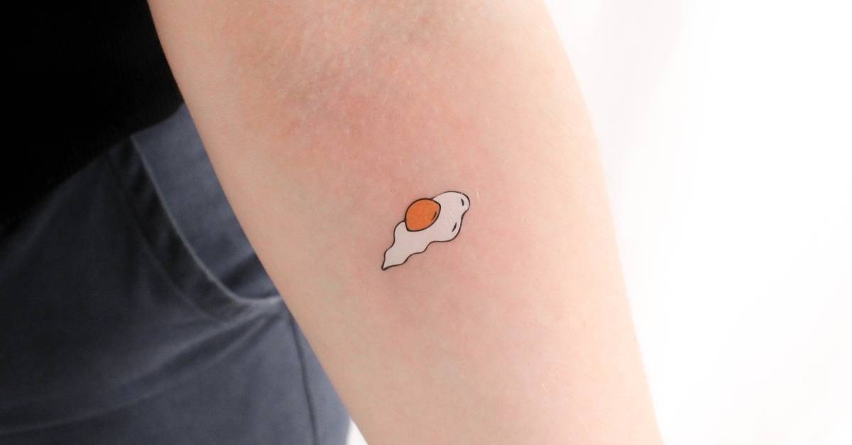 Color fried egg temporary tattoo done on the inner