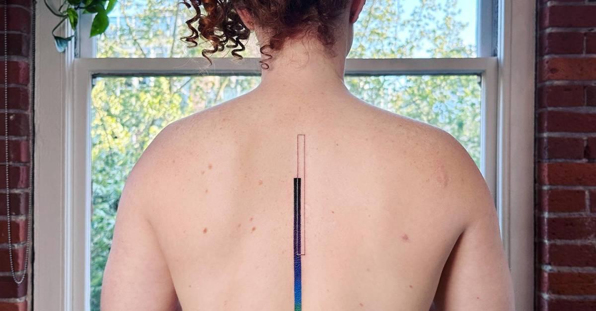 Visible spectrum tattoo located on the spine.